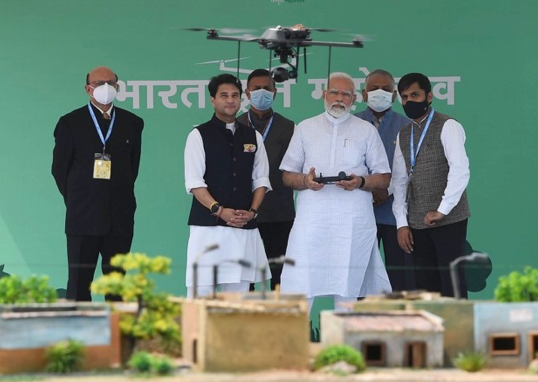 Hon'ble Prime Minister flying drone at the inauguration of the Bharat Drone Mahotsav on May 27, 2022